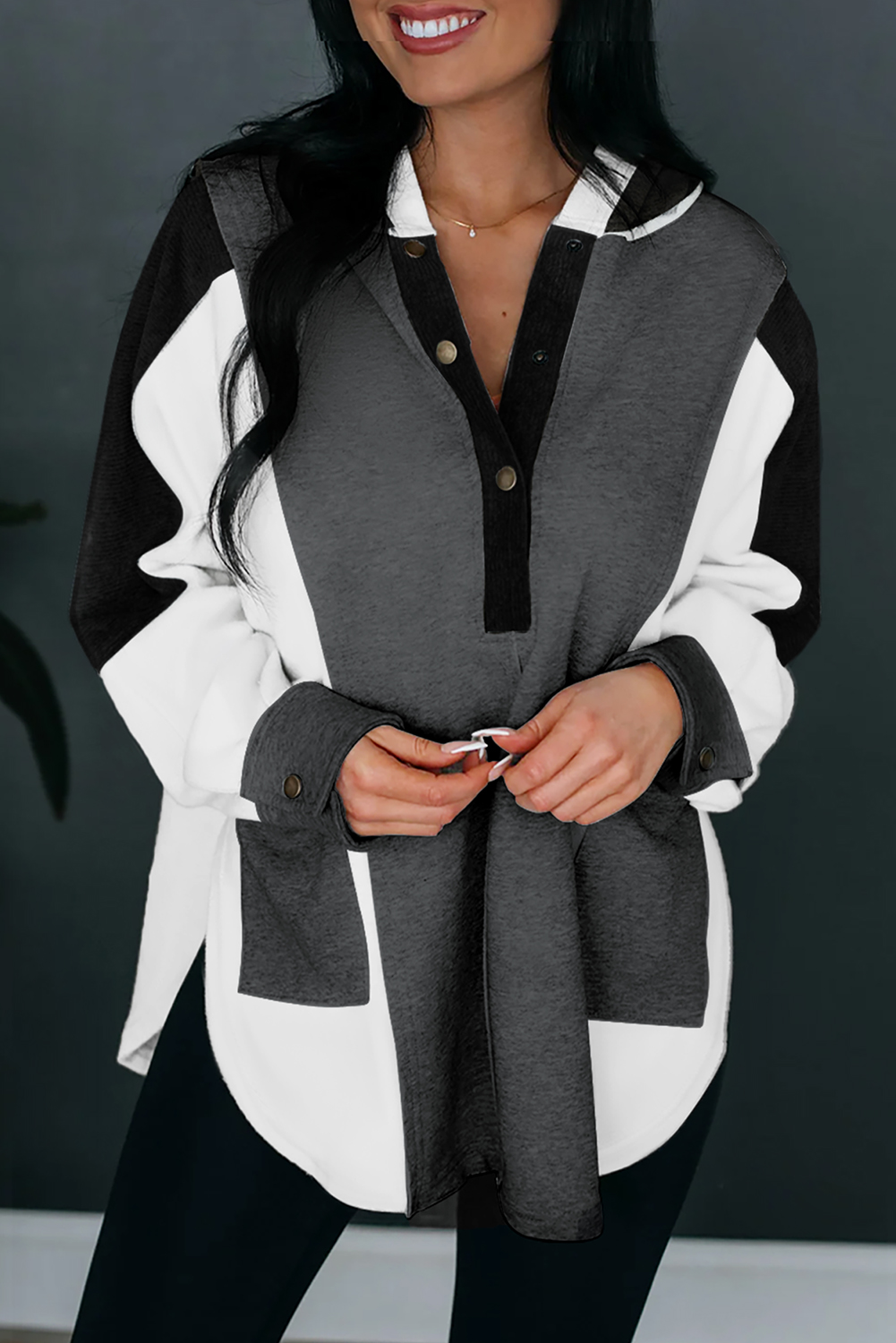 $11.7 Black Color Block Exposed Seam Buttoned Neckline Hoodie Wholesale