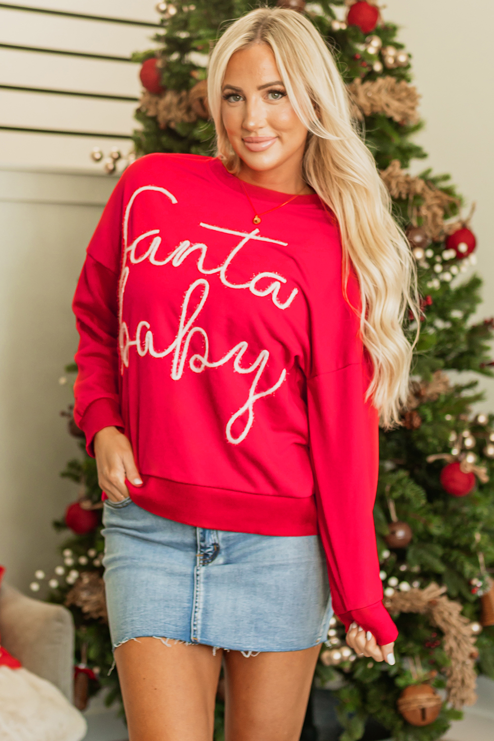 $8.75 Fiery Red Christmas Santa Baby Tinsel Graphic Sweatshirt Wholesale