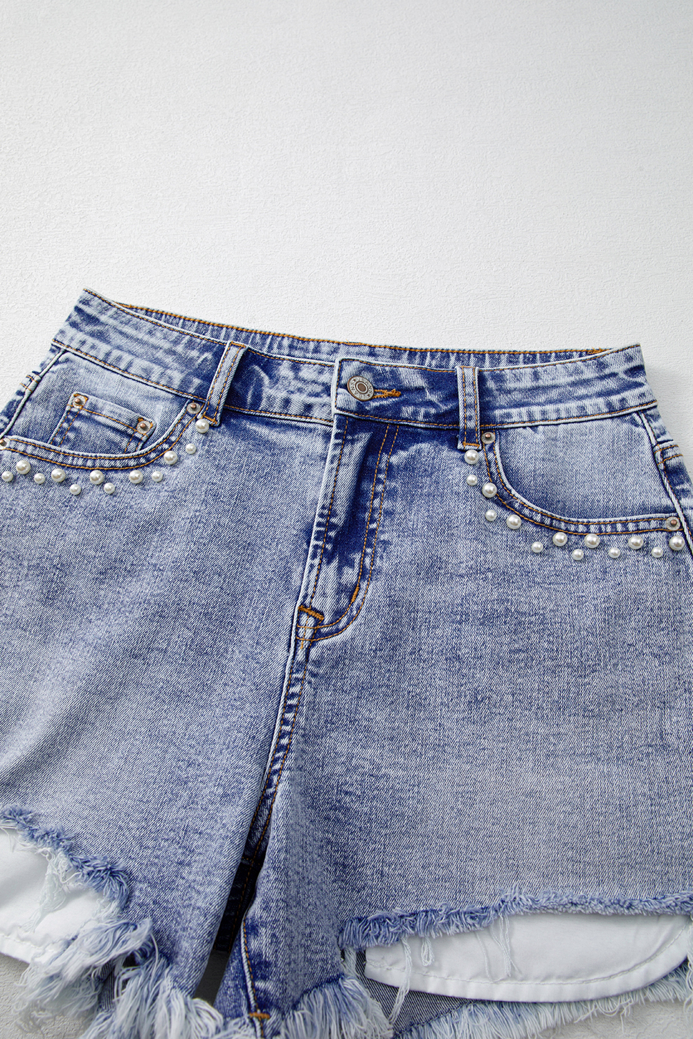 $11.1 Beau Blue Pearl Studded Pockets Raw Hem Denim Shorts Wholesale